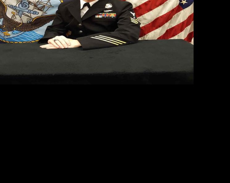 Elizabeth Carlin wears a different uniform outside of UNCG