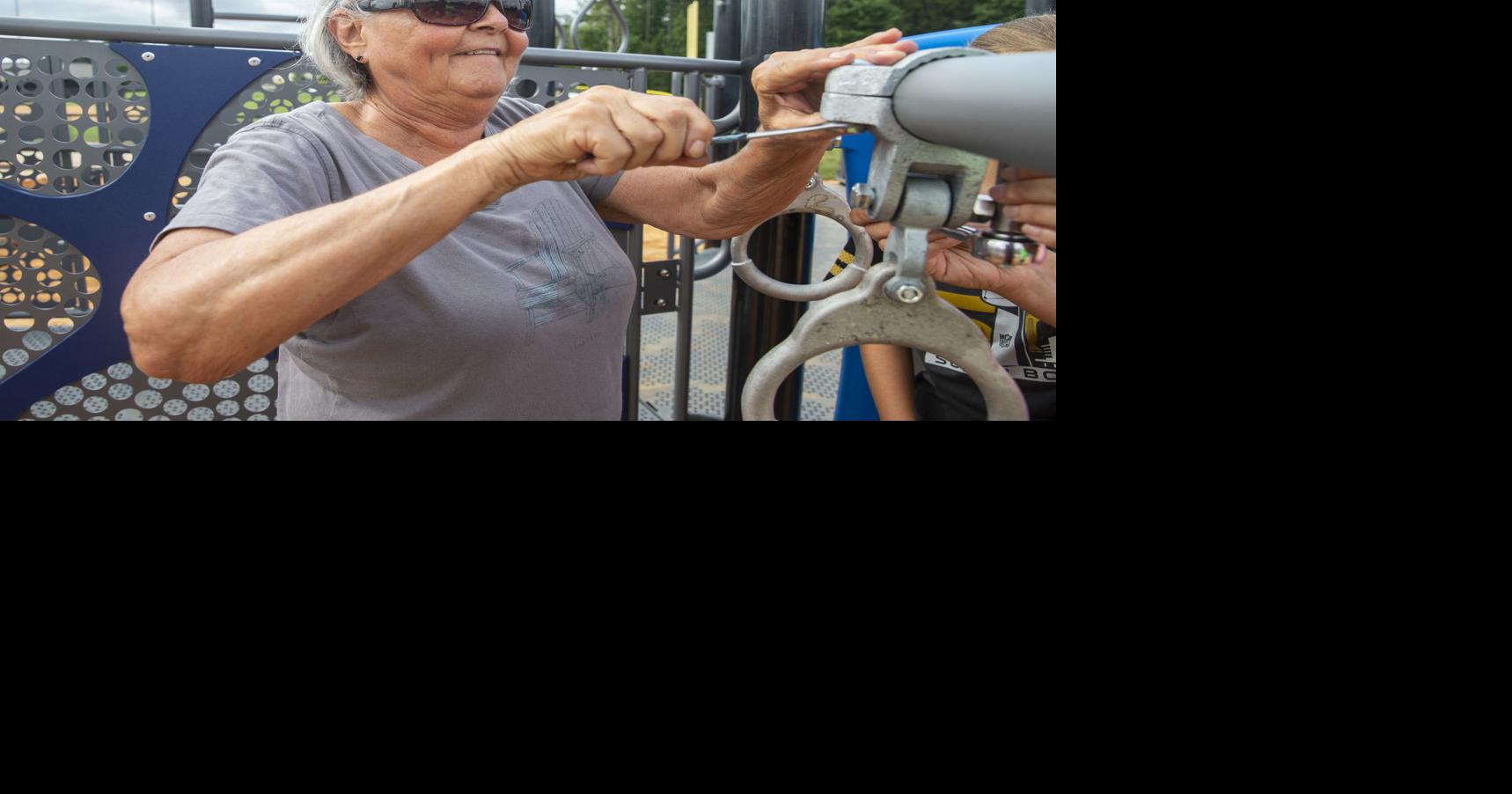 Photos: Volunteers assemble universally accessible playground at ...