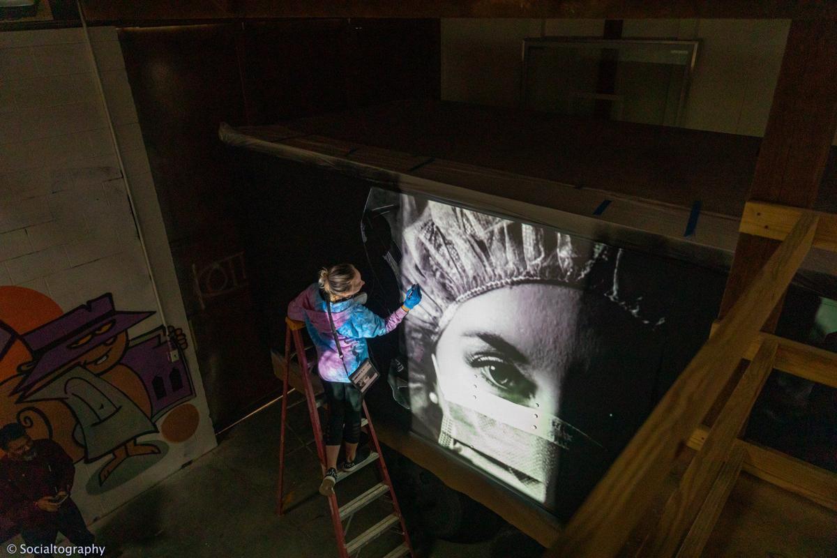 Jenna Rice and Raman Bhardwaj create murals on a former mail truck