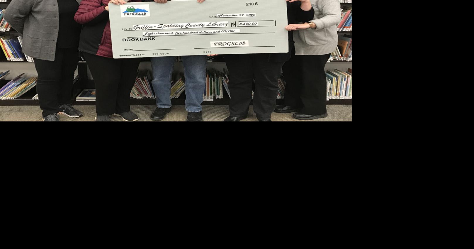 FROGSLIB donates to the Griffin library | News | griffindailynews.com