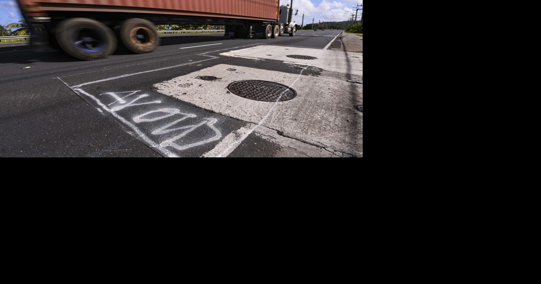 Power contractor marks road to avoid utilities damage during heavy ...