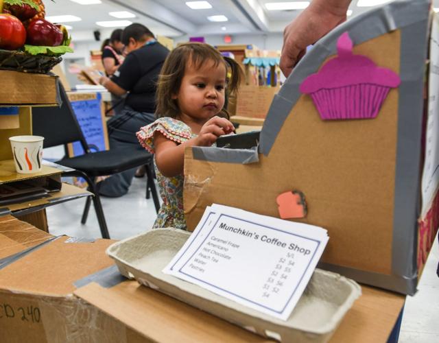 Children create, explore, imagine using everyday objects in Global ...