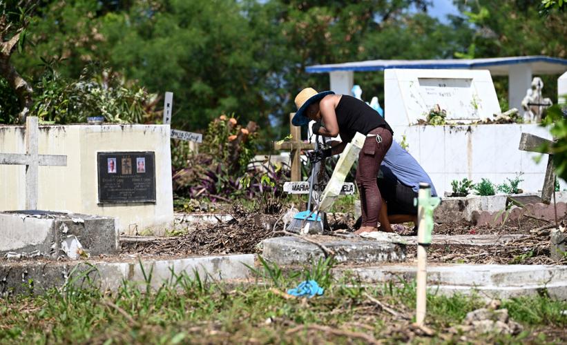 All Souls’ Day preparations at Limtiaco Cemetery | Multimedia | guampdn.com