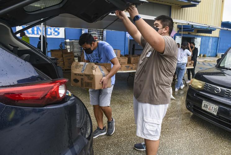 Yigo residents issued food commodities during distribution | News ...