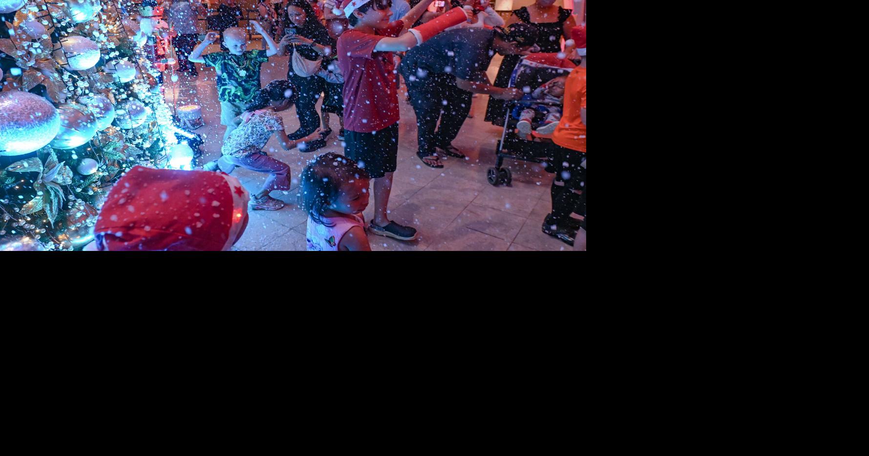 PHOTOS: Children play in ‘falling snow’ at Hyatt Regency Guam ...