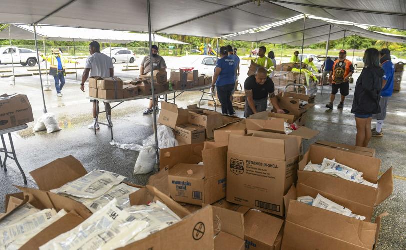 Yigo residents issued food commodities during distribution | News ...