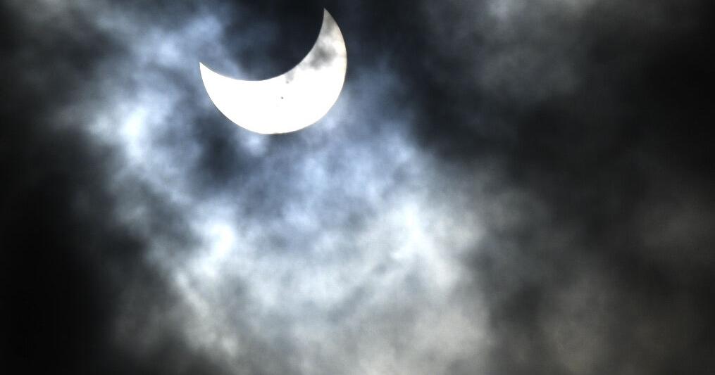 Clouds and rain make viewing partial solar eclipse difficult | News ...