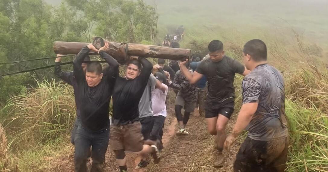 Faithful make Good Friday trek in the mud | News | guampdn.com