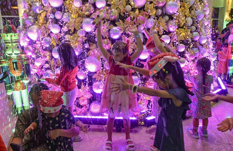 PHOTOS: Children play in ‘falling snow’ at Hyatt Regency Guam ...