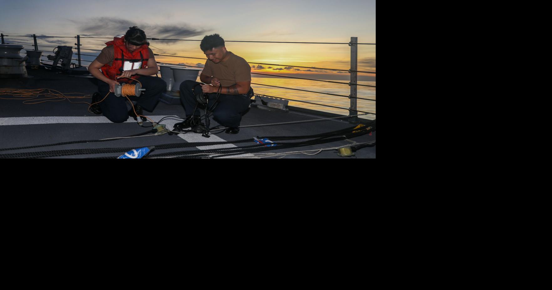 Sailor from Guam sets up a sound-powered phone aboard USS Howard ...