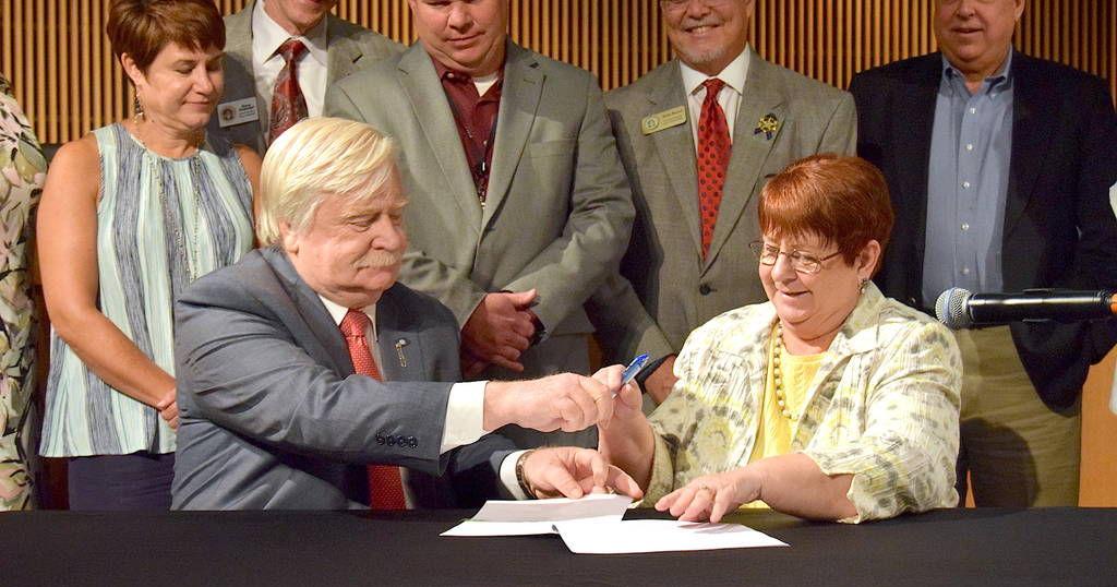 Gwinnett, Snellville leaders sign library design agreement | News ...
