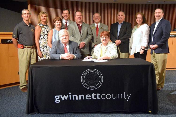 Gwinnett, Snellville leaders sign library design agreement | News ...