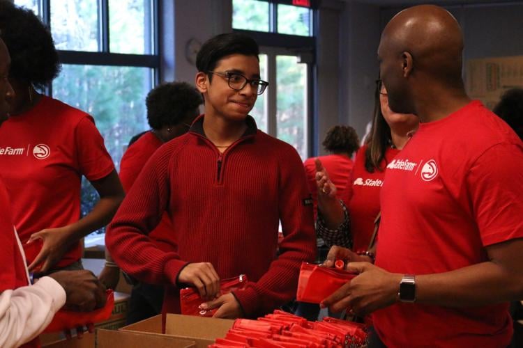 Norcross grad and Atlanta Hawk Brandon Goodwin helps stuff 1,000 ...