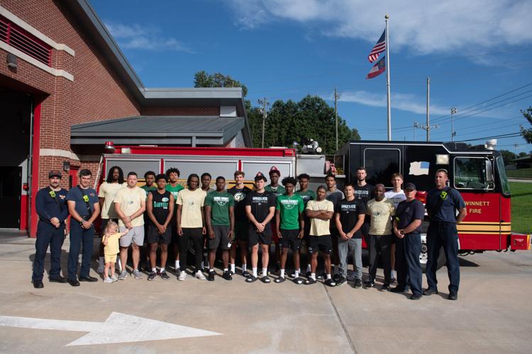 Service project: Georgia Gwinnett College men's basketball team trades ...