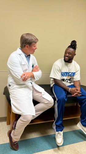 Grayson grad — now in the NFL — reunites with surgeon at Children's ...