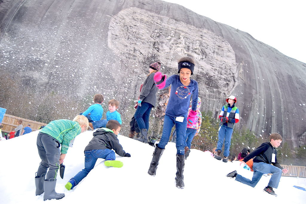 Despite warm weather, families enjoying winter at ‘Snow Mountain ...