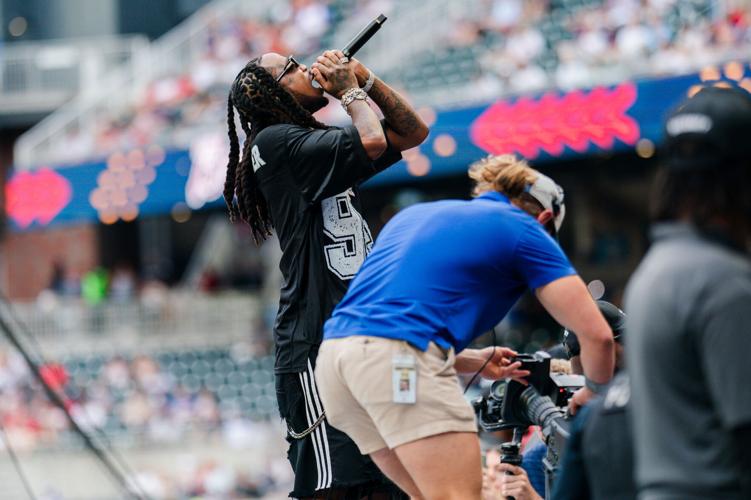 Gwinnett native Quavo surprises fans with performance on Braves dugout ...