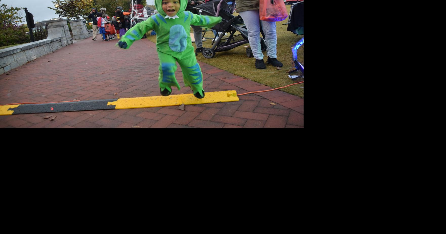 Hundreds go trick-or-treating at Lawrenceville Boo Fest despite cold ...