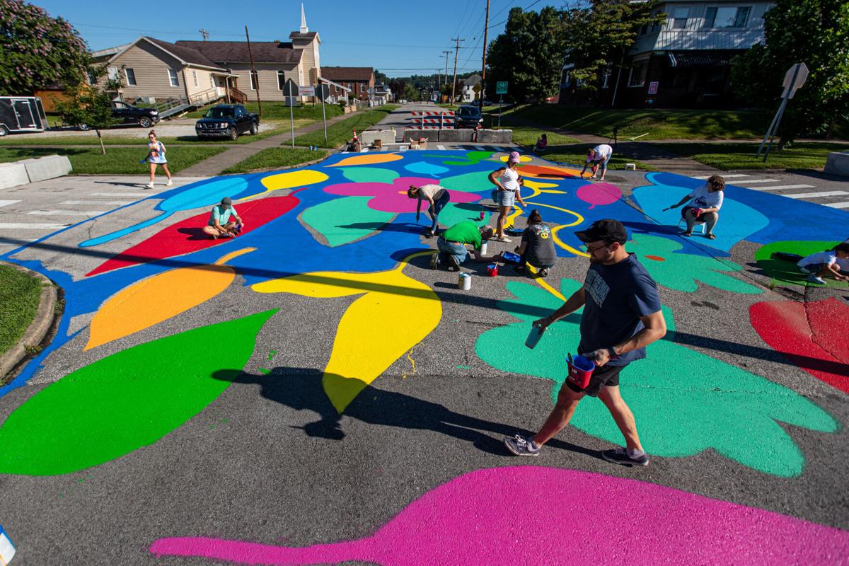 Volunteers help bring neighborhood asphalt art projects to life | News ...