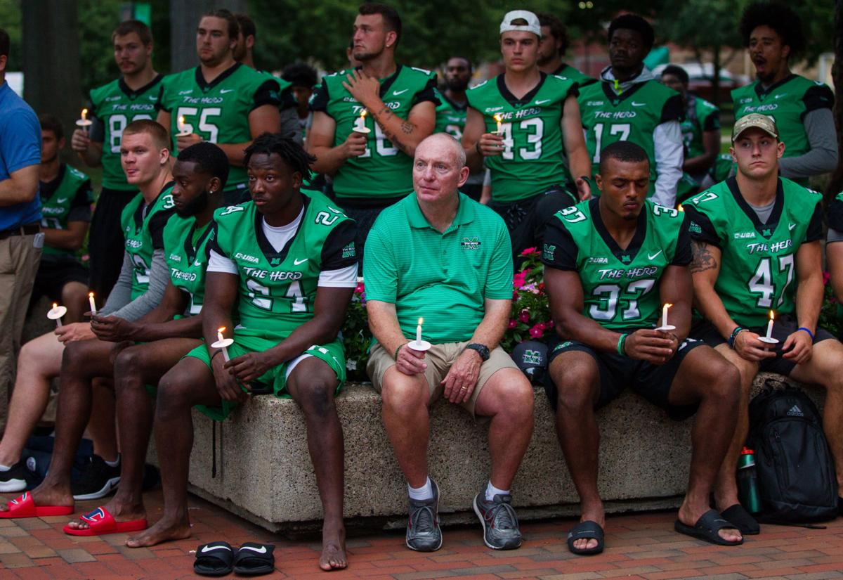 Photos: Candlelight vigil for former Marshall quarterback Reggie Oliver ...