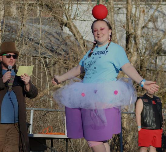 Costume contest participants strut their stuff before taking the plunge ...