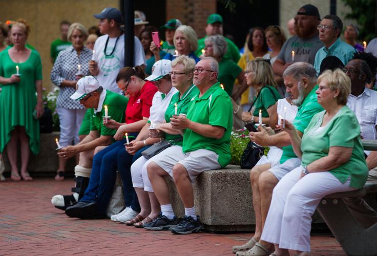 Photos: Candlelight vigil for former Marshall quarterback Reggie Oliver ...