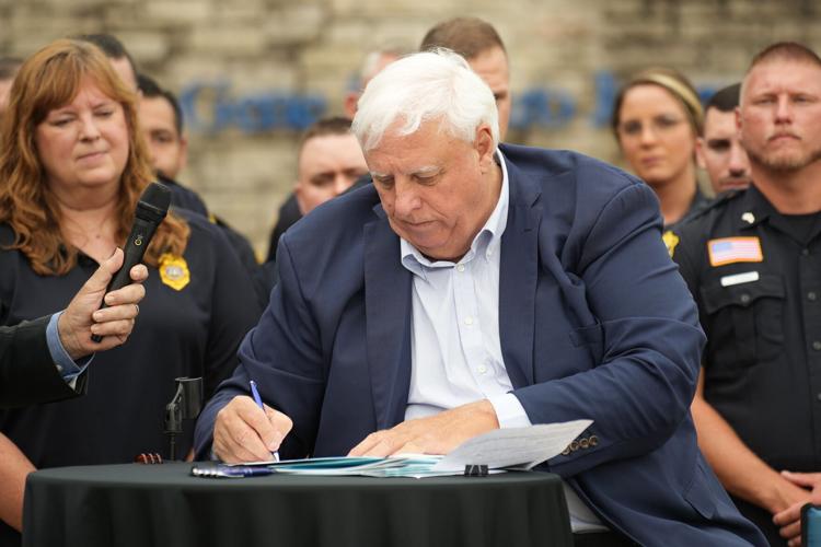 Justice signs corrections bills into law | News | herald-dispatch.com