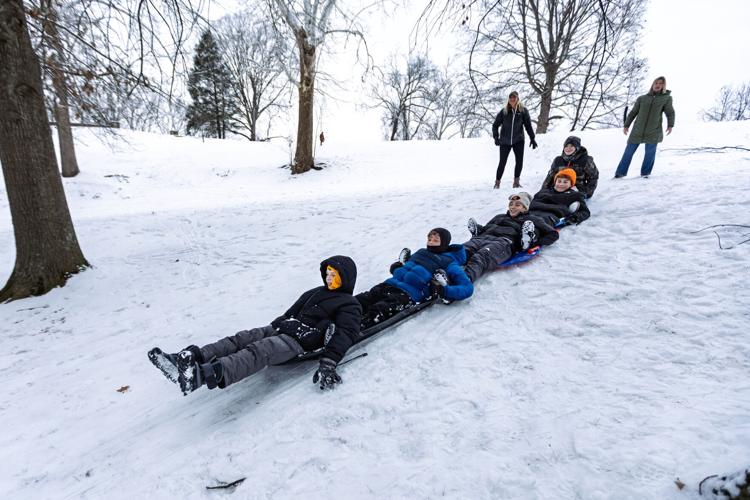 Sleds, shovels and snowmen: Huntington residents brave the cold for ...