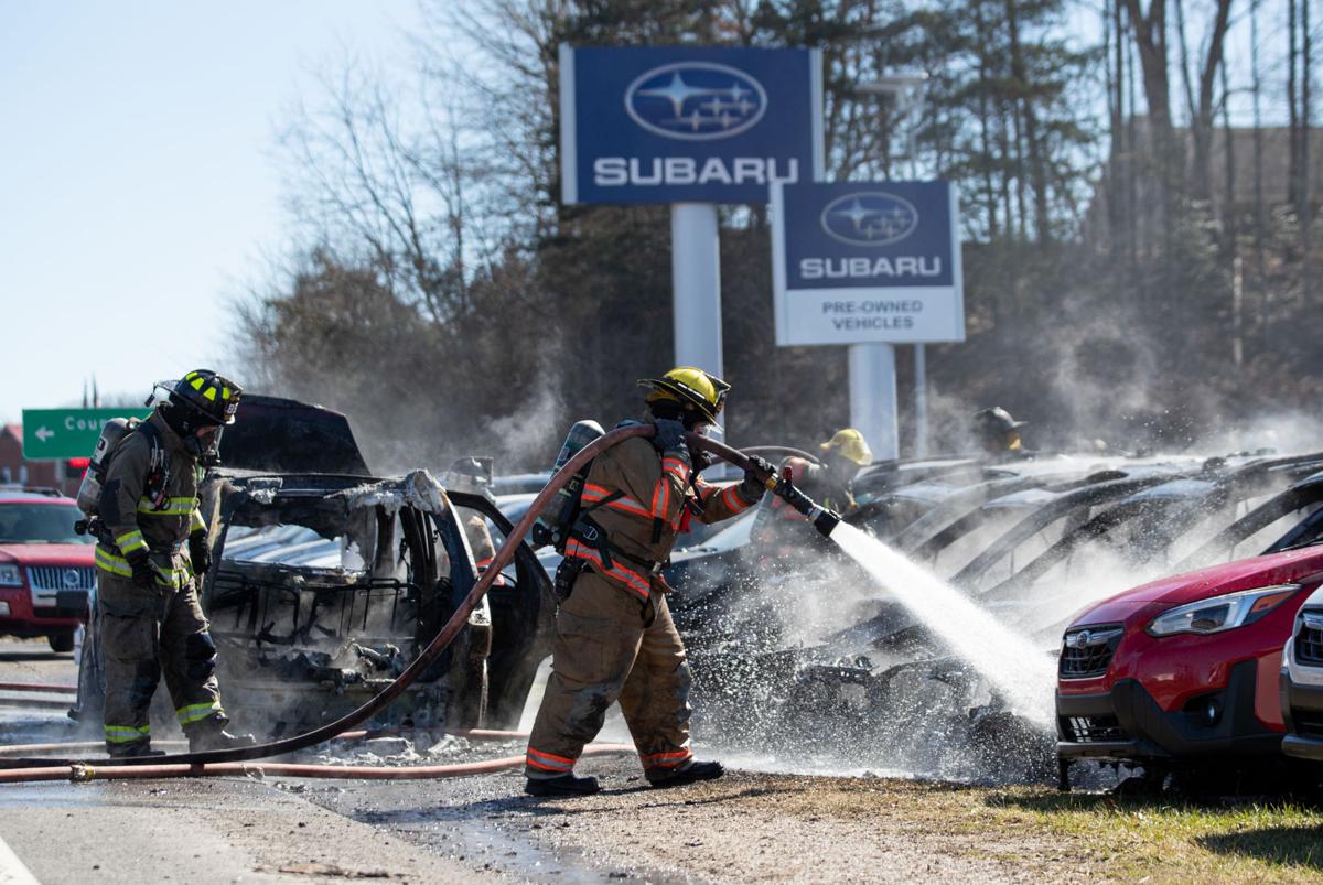 Photos: Firefighters battle vehicle fire at River City Subaru ...