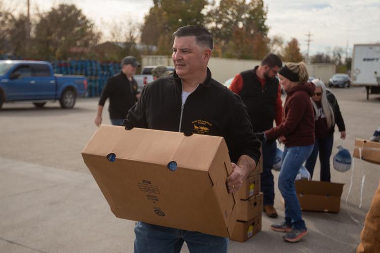 Group distributes nearly 1,000 turkeys ahead of holiday season | News ...