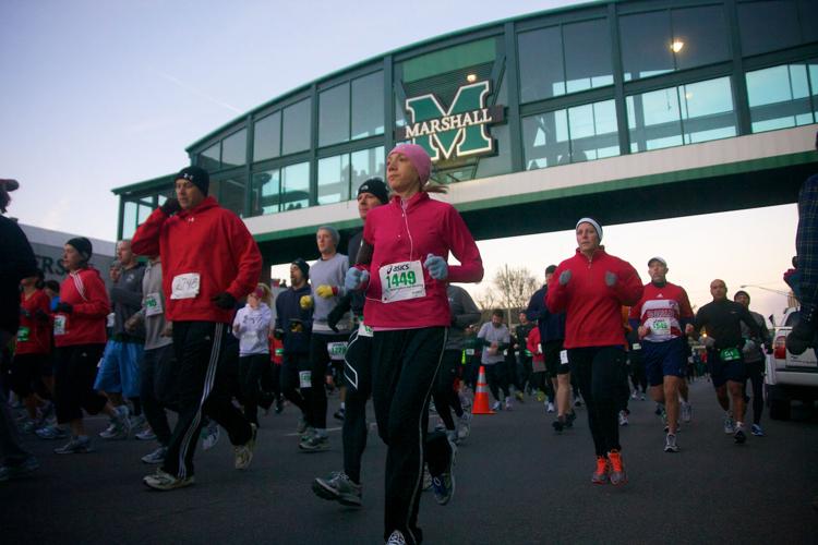 Thousands endure chilly air to run Marshall Marathon | Sports | herald ...