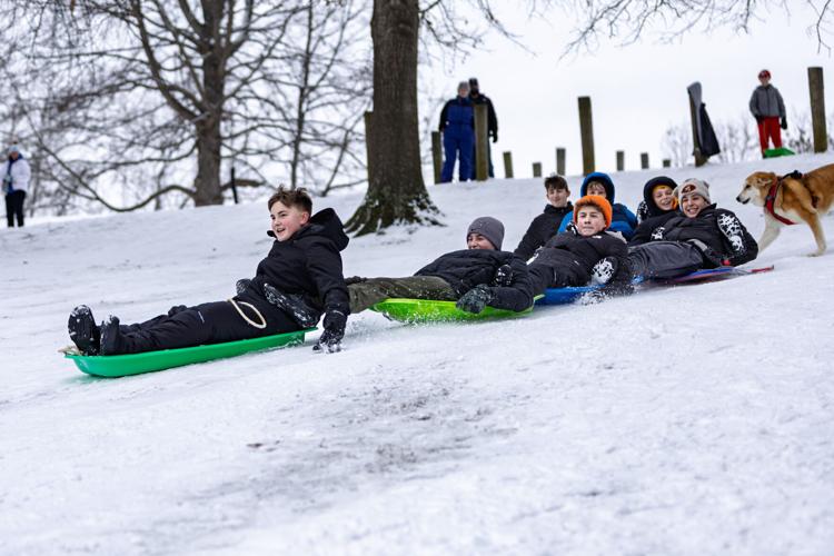 Sleds, shovels and snowmen: Huntington residents brave the cold for ...