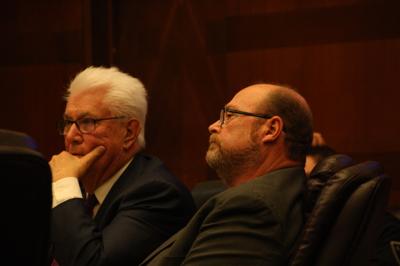 Father accused of aiding and abetting son in officer shooting gets year ...