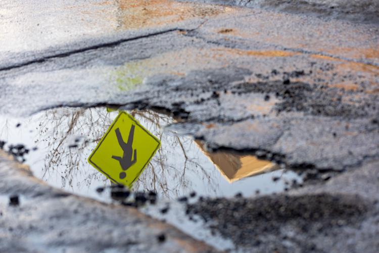 Local officials start cold patch maintenance on potholes formed by ...