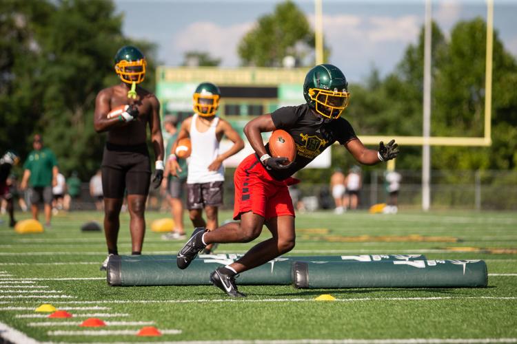 Photos: HHS football team conducts first day of summer practice ...