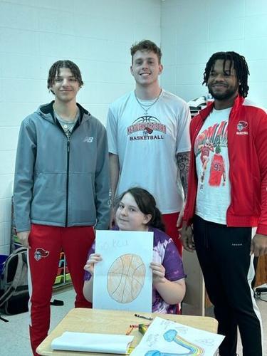KCU men's basketball participates in Read Across America Week ...