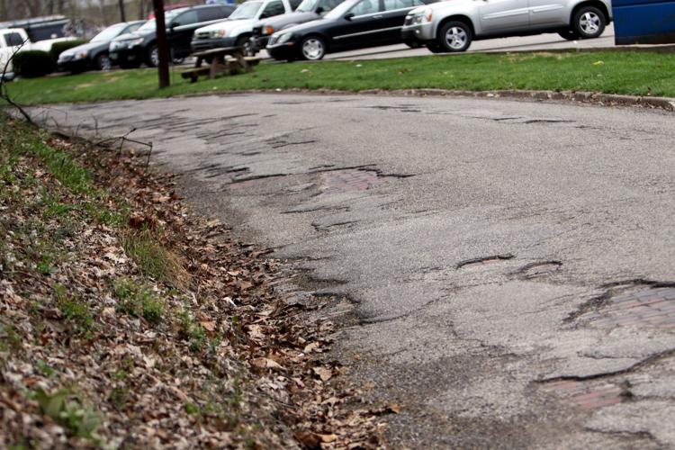 Gallery: Work begins on potholed streets around Huntington | Photos ...