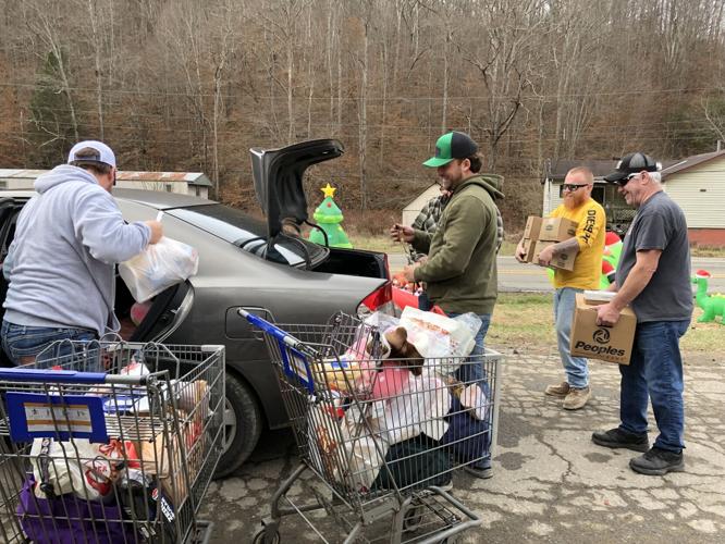 Volunteers, Dunlow Community Center employees help families during the ...