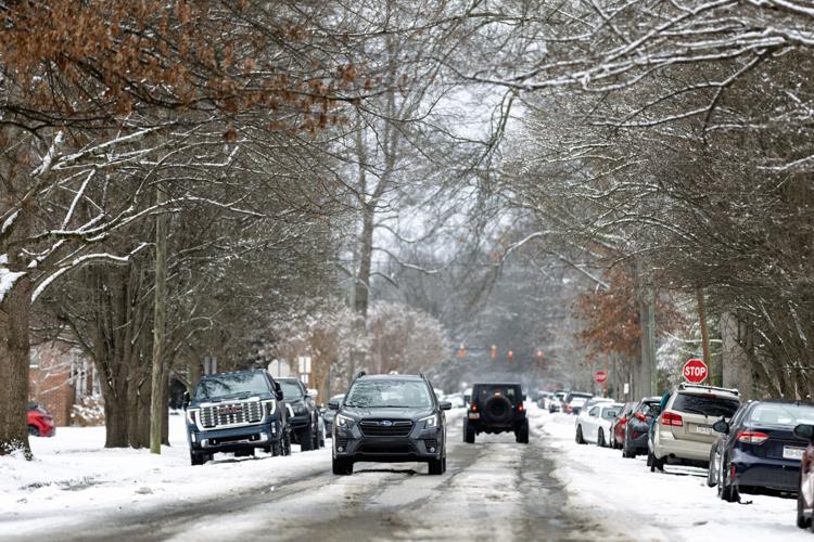 Sleds, shovels and snowmen: Huntington residents brave the cold for ...