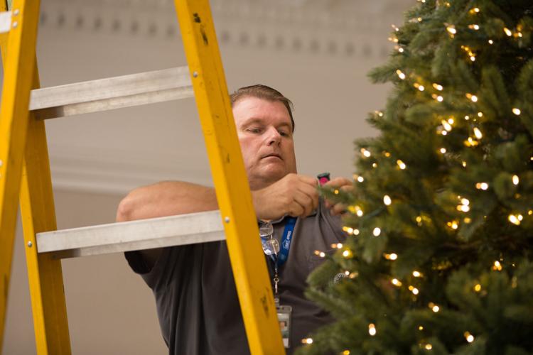Workers put up Christmas tree at City Hall | News | herald-dispatch.com