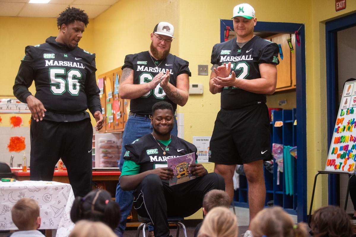 Marshall football players celebrate Halloween with Our Lady of Fatima ...