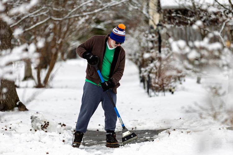 Sleds, shovels and snowmen: Huntington residents brave the cold for ...
