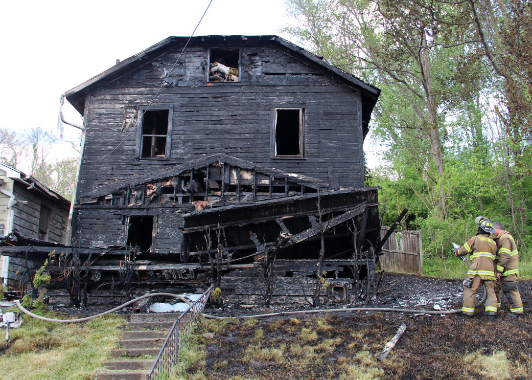 Woman injured after neighboring house catches fire | News | herald ...