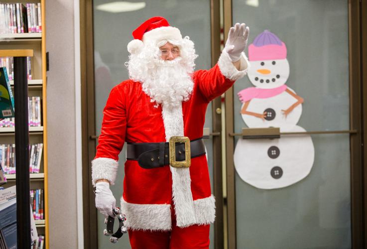 Children visit with Santa at Chesapeake library | News | herald ...