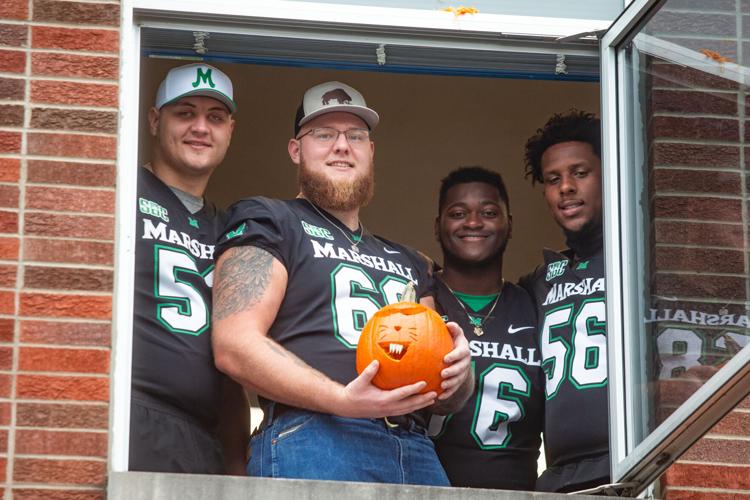 Marshall football players celebrate Halloween with Our Lady of Fatima ...