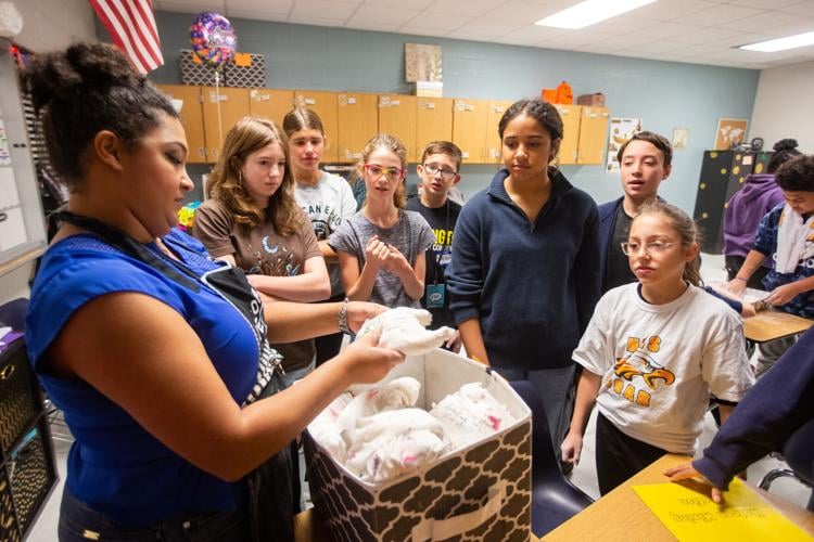 Photos: Students mummify chickens at Huntington Middle School ...