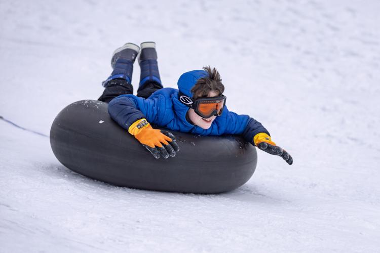 Sleds, shovels and snowmen: Huntington residents brave the cold for ...