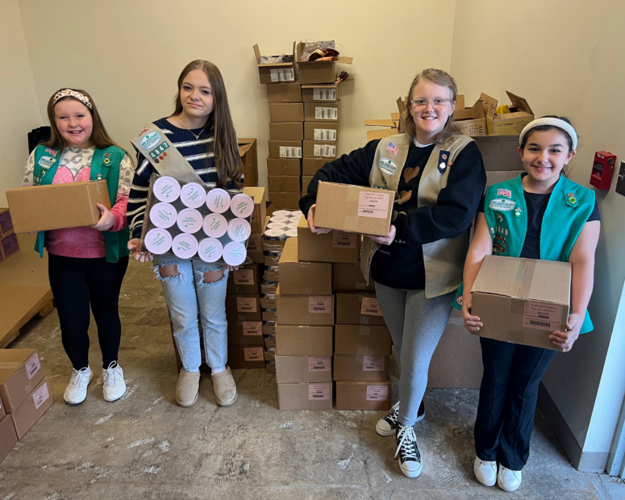 Girl Scouts honor local heroes by donating candy, nuts to veterans ...
