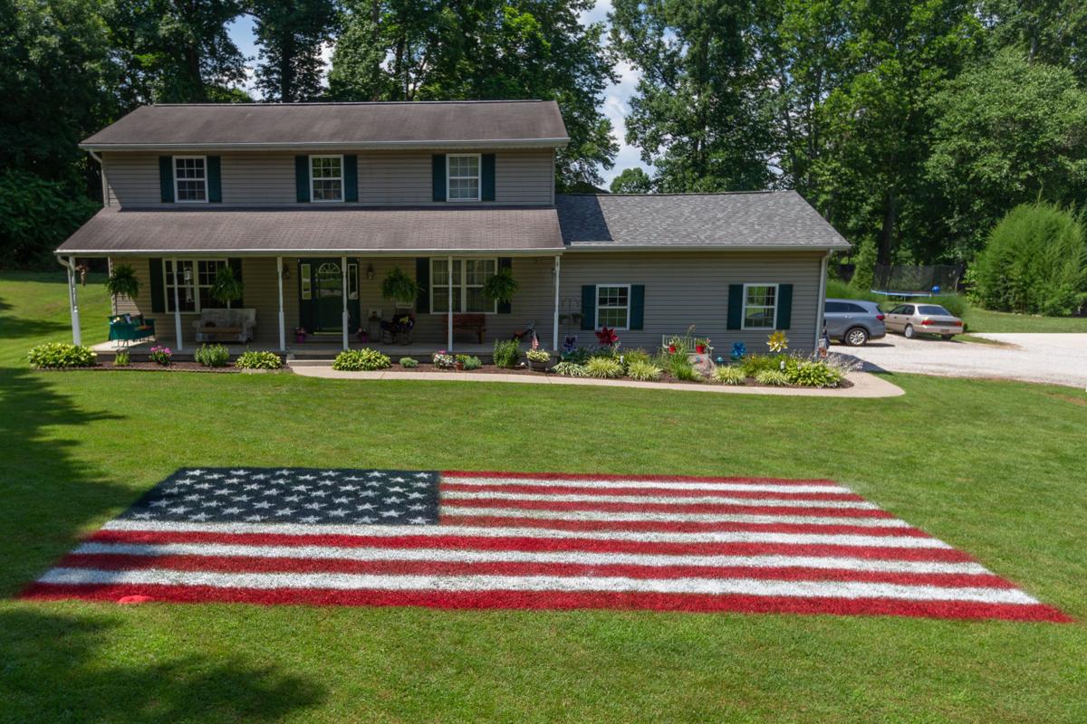 Ona couple paints giant American flag in front yard | News | herald ...