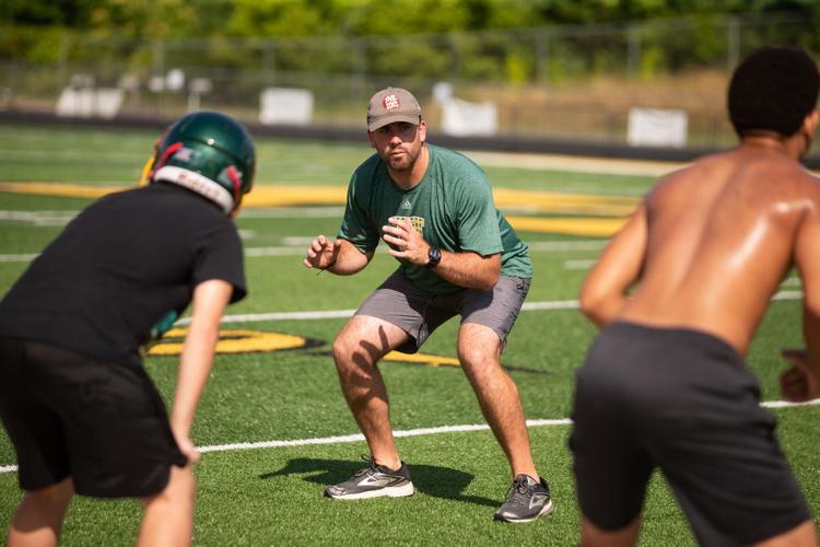 Photos: HHS football team conducts first day of summer practice ...